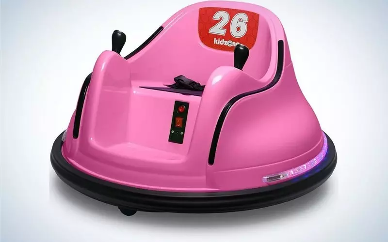 Kidzone pink toy toy koronto oo leh suunka badbaadada madow iyo badhamada cas ee hortiisa.